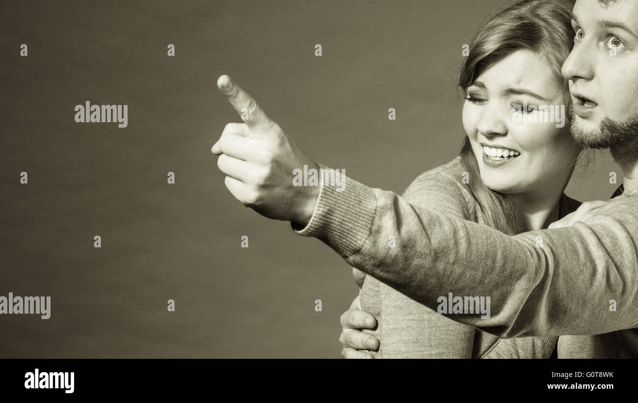 Fear and scare. Two young terrified scared people. Stressed woman and ...