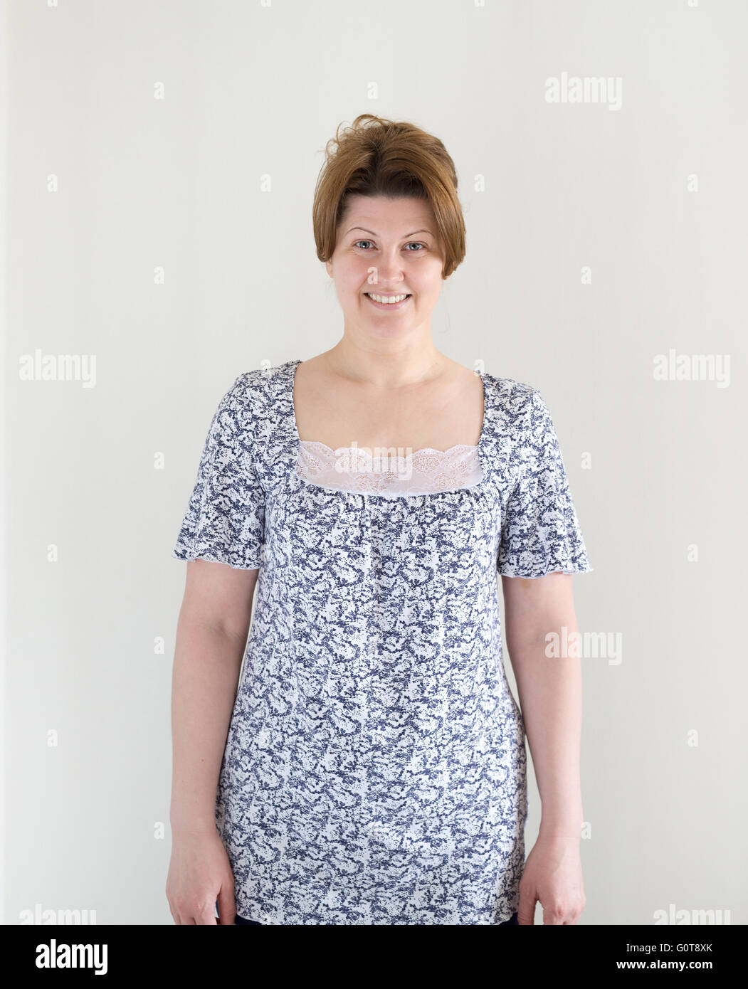 Woman in house clothes on light background Stock Photo - Alamy