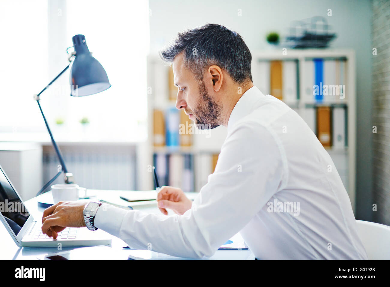 Typing in office Stock Photo - Alamy