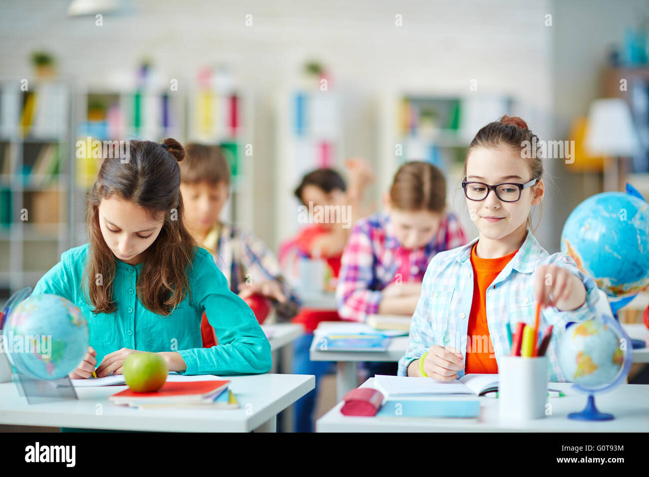 Studying in school Stock Photo - Alamy