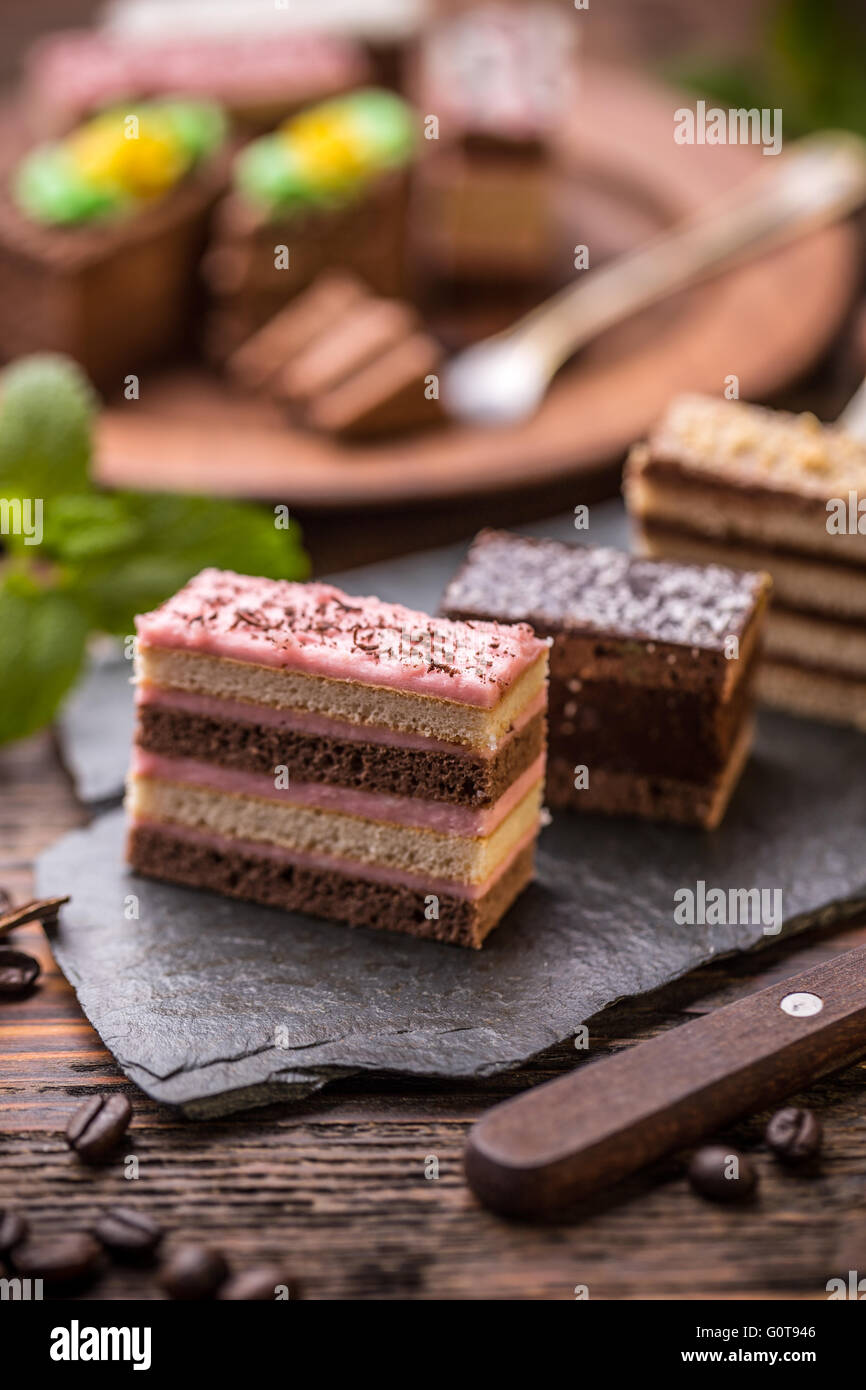 Assorted different mini cakes with cream Stock Photo - Alamy
