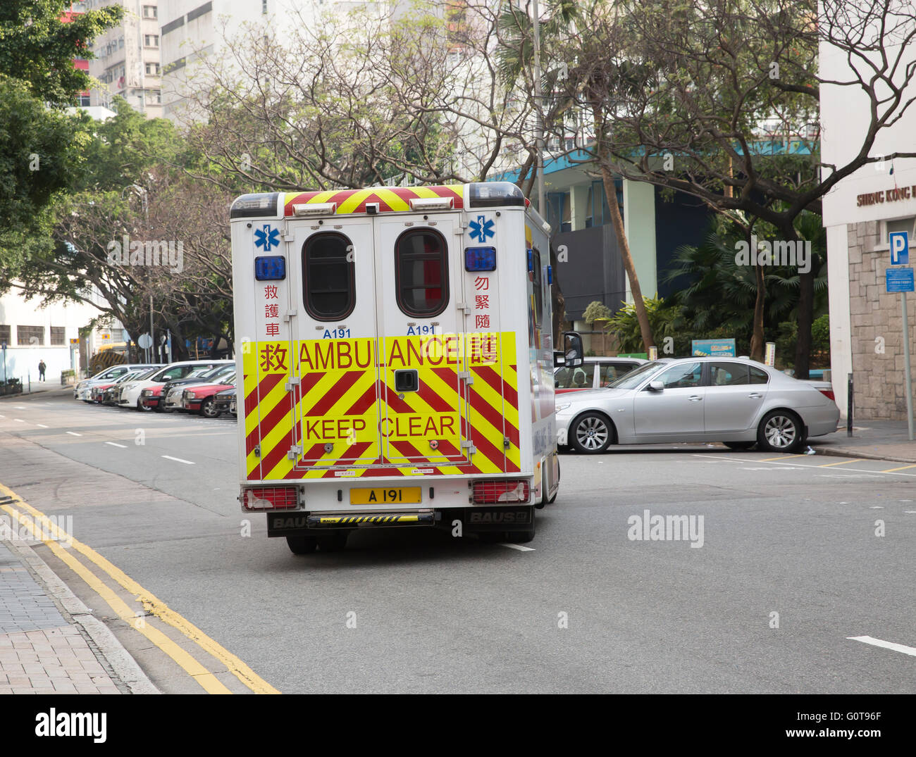 Rear of an Ambulance as it leaves a station in Hong Kong Stock Photo ...