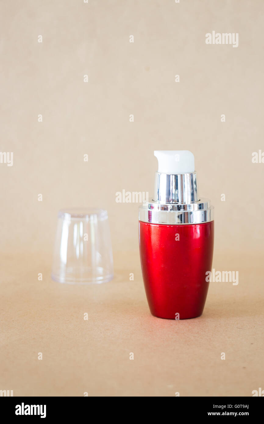 Shiny hard red bottle on brown background, stock photo Stock Photo - Alamy