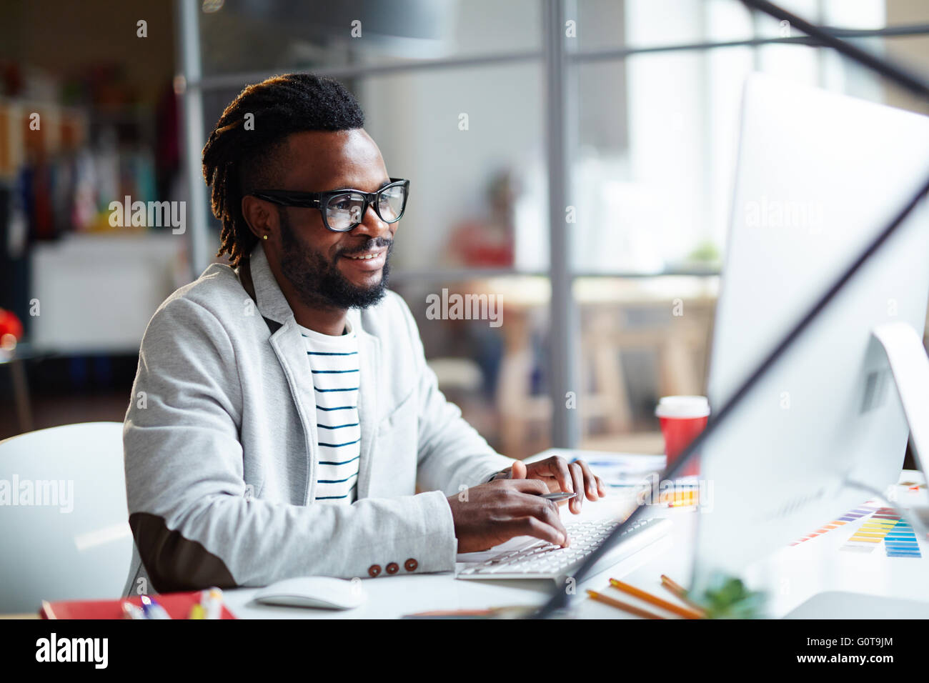 African man technology typing hi-res stock photography and images - Alamy