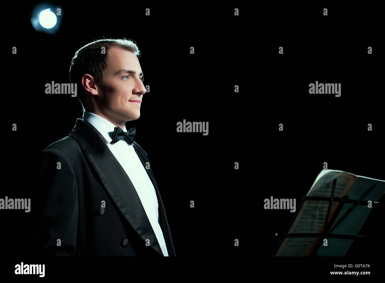 Studio photo of music conductor smiles public Stock Photo - Alamy