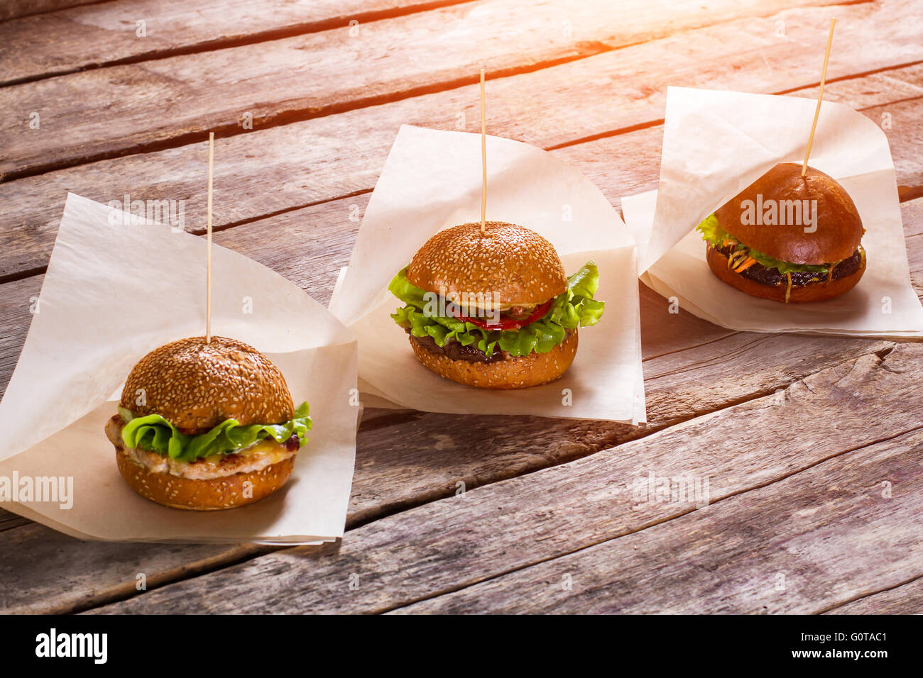 Hamburgers on white wrappers Stock Photo - Alamy