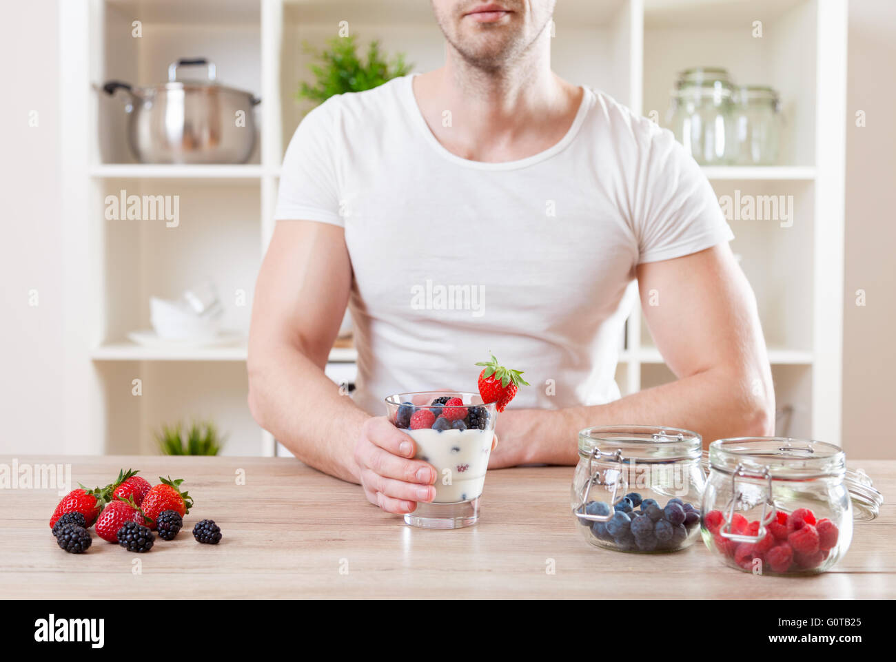 Man eating yoghurt hi-res stock photography and images - Alamy