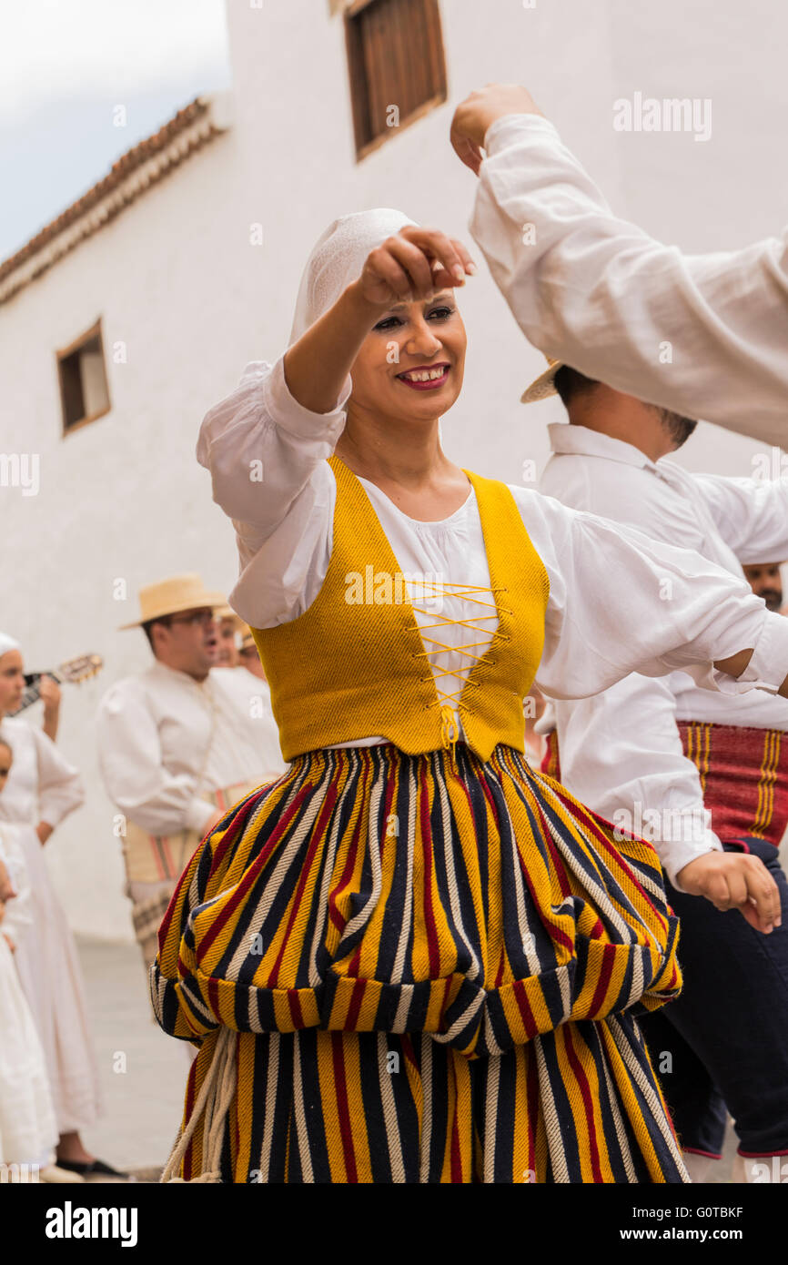 Dancers in traditional 19th century dress dancing in a scene as part of ...