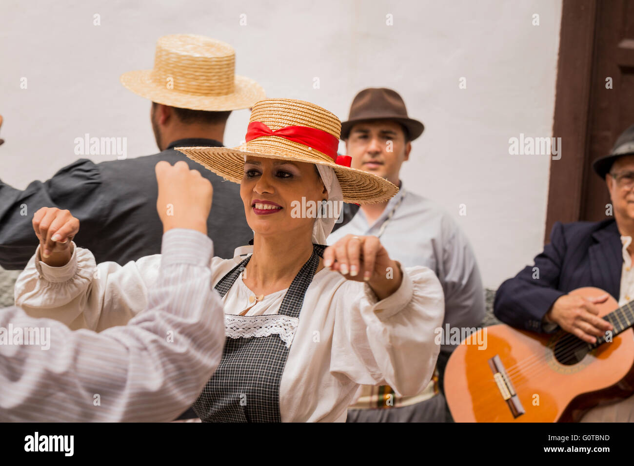 Dancers in traditional 19th century dress dancing in a scene as part of ...