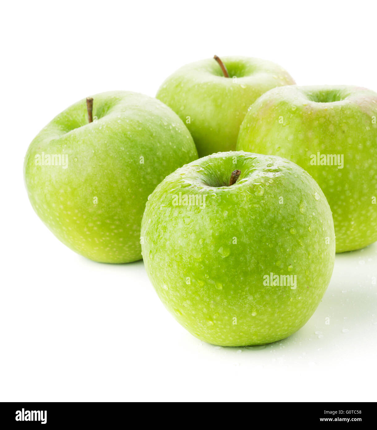 Four ripe green apples. Closeup. Isolated on white Stock Photo - Alamy