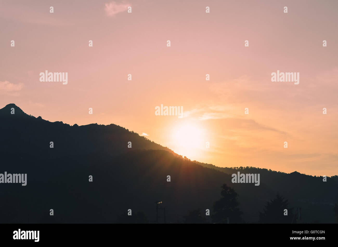 Clouds pink sky over mountain hi-res stock photography and images - Alamy