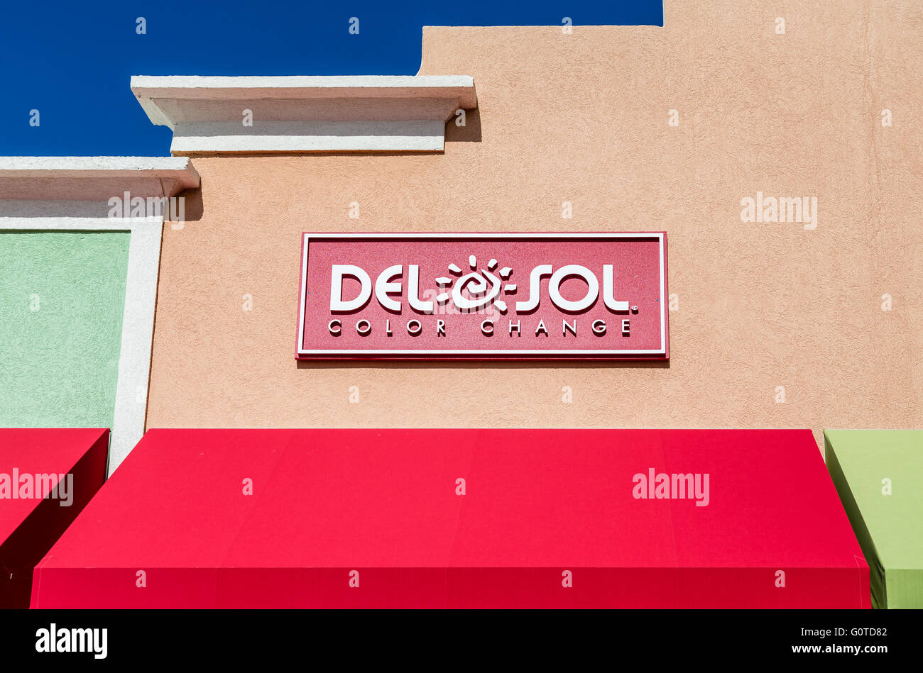 Del Sol Color Change sign on stucco wall Stock Photo - Alamy