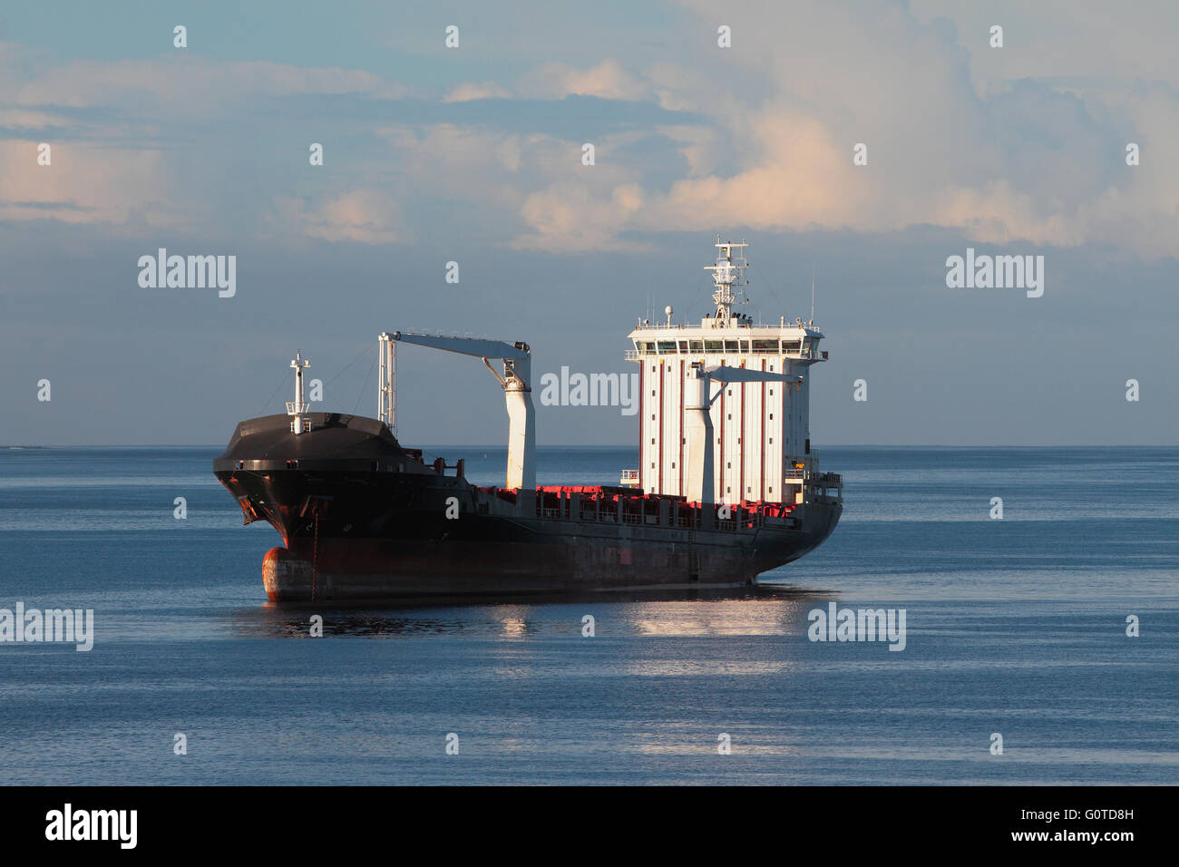 Cargoship on raid in sea Stock Photo - Alamy