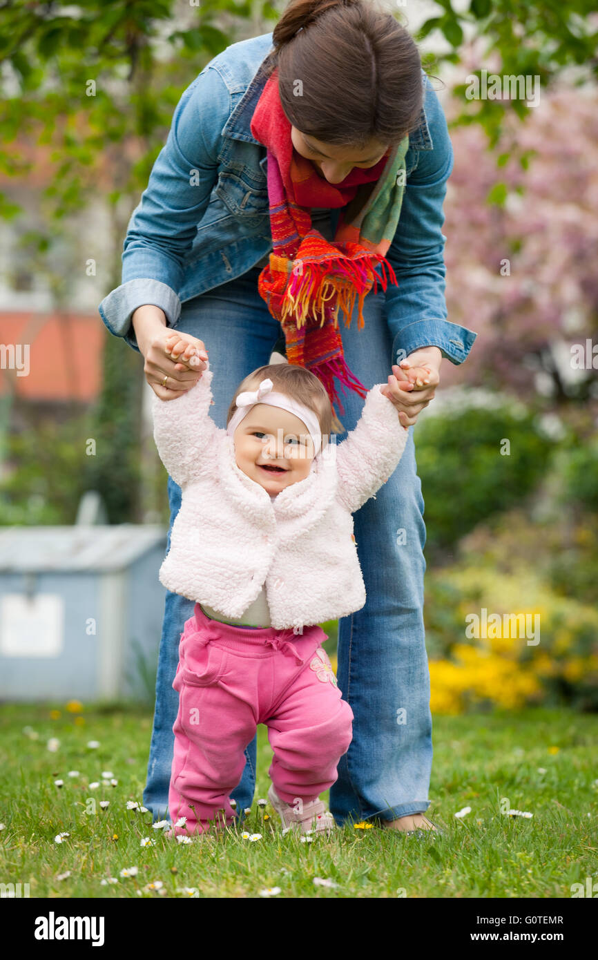 Baby's first steps Stock Photo - Alamy