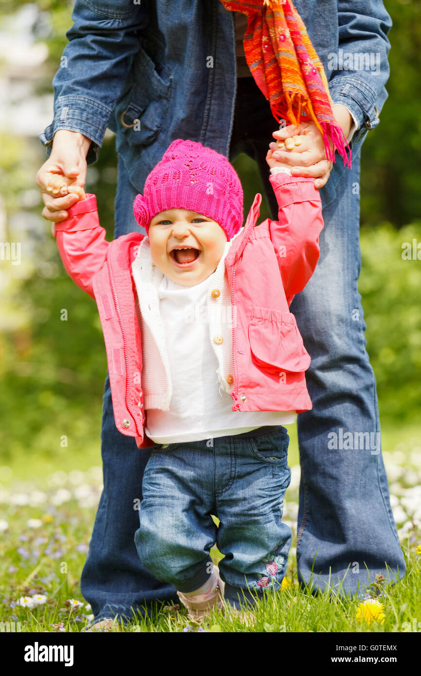 Baby's first steps Stock Photo - Alamy