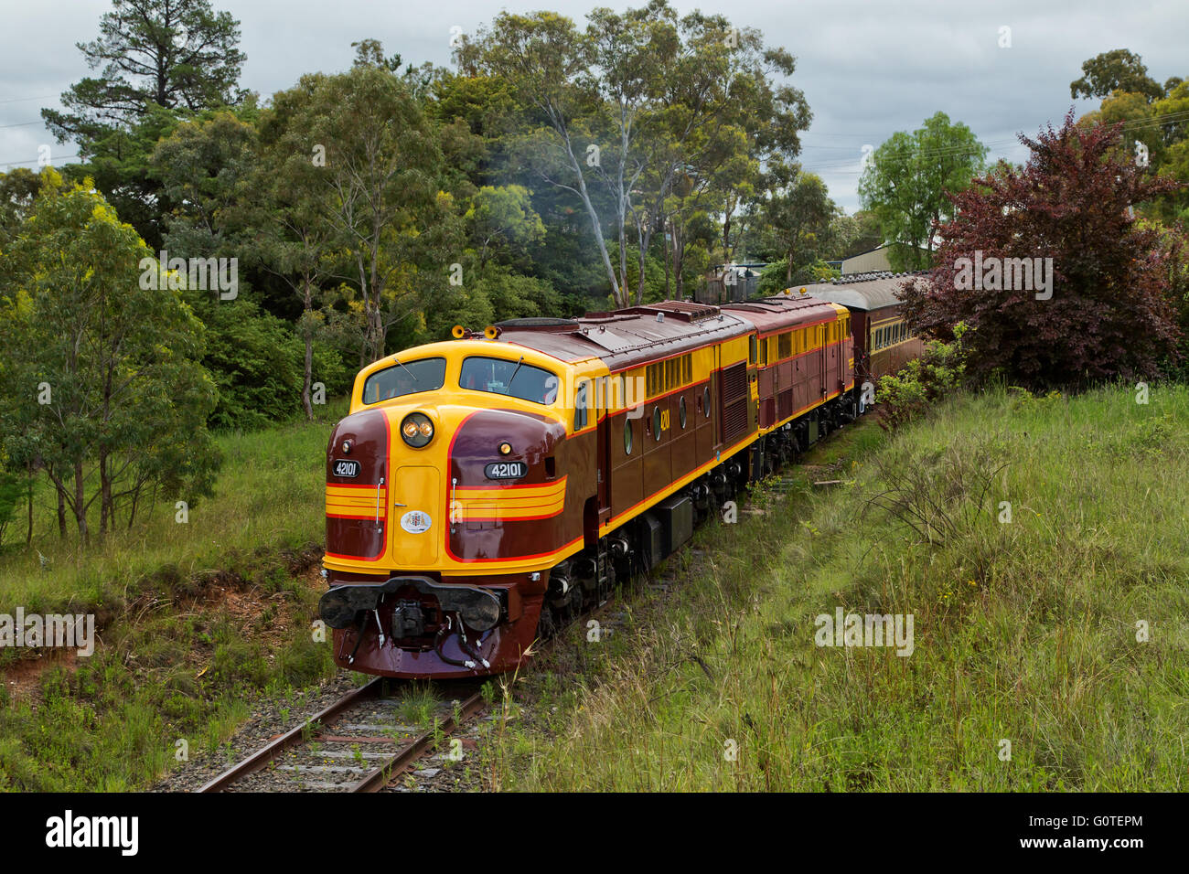 Two heritage diesel locomotives depart a country town in Australia ...