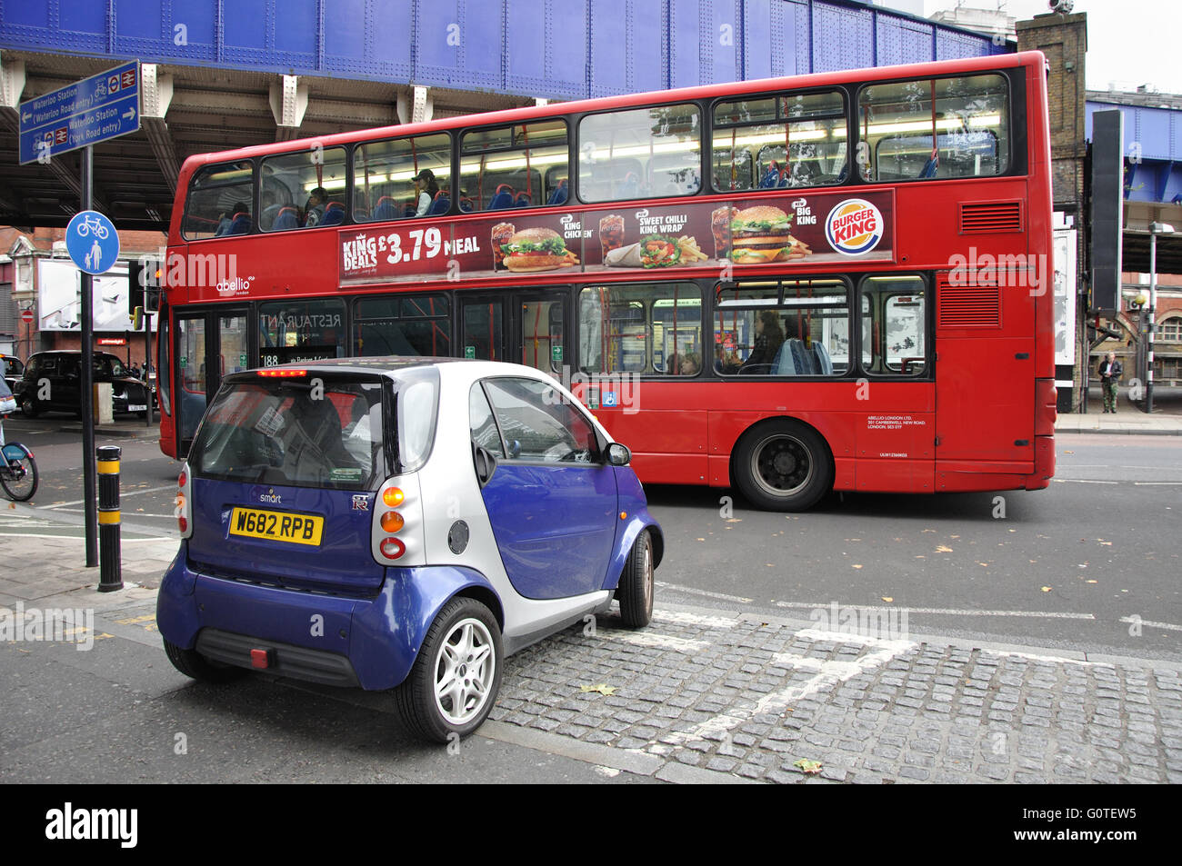 Smart car and London bus, London, England, UK Stock Photo - Alamy