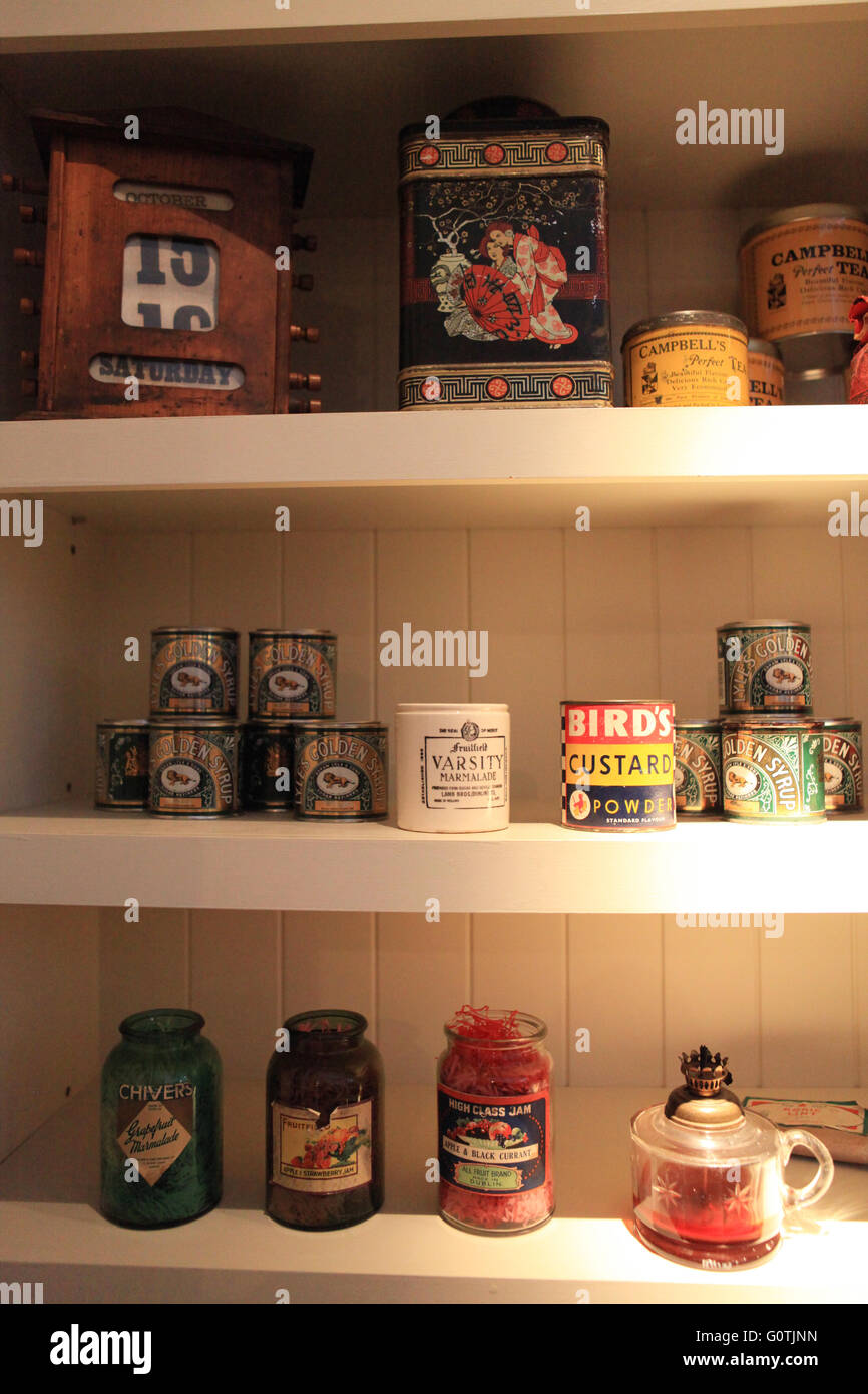 Display of old vintage tins on a kitchen dresser on shelves Stock Photo ...