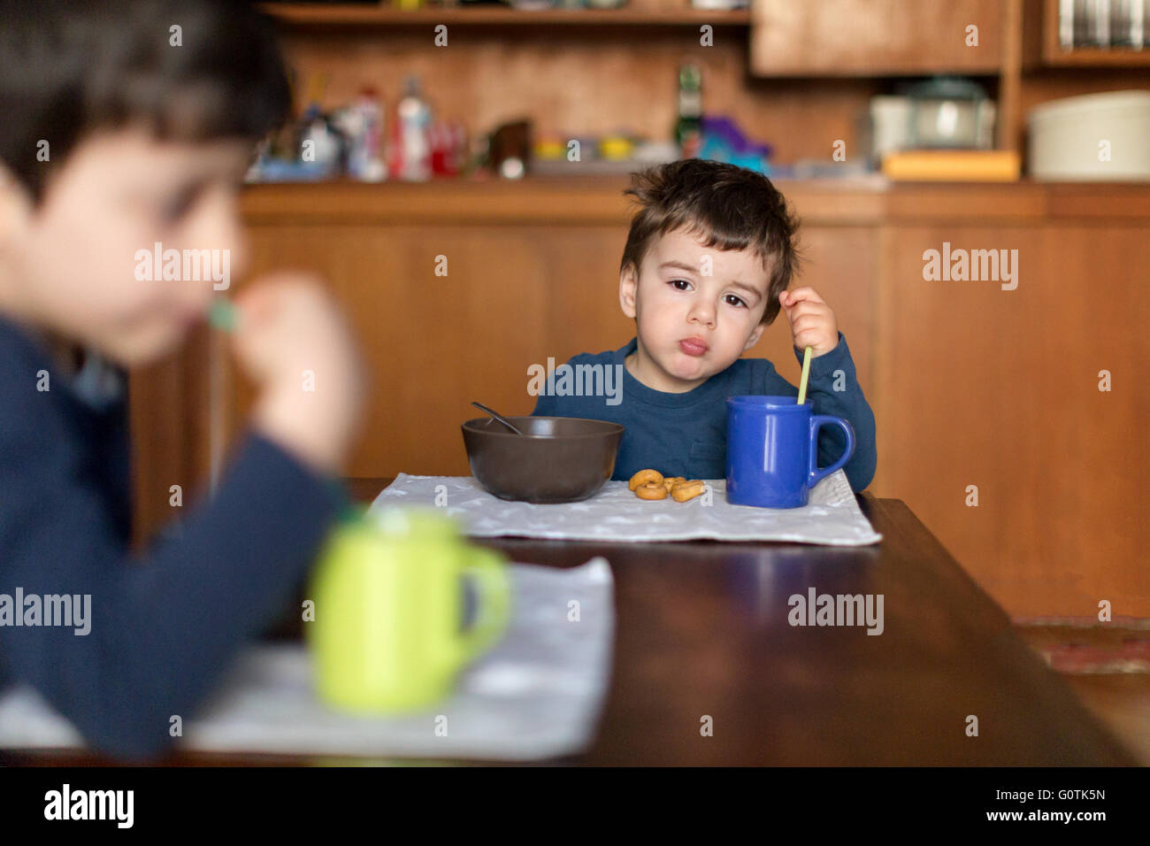 Two boys having breakfast together Stock Photo - Alamy