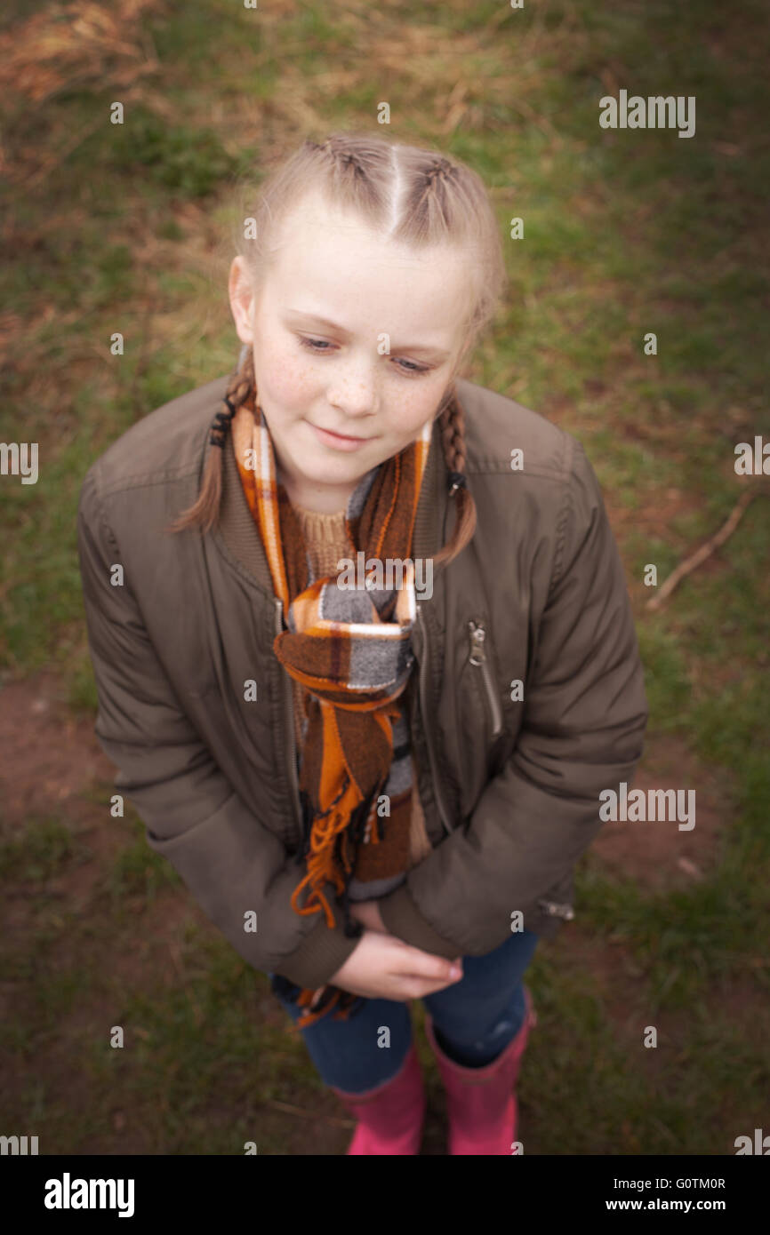 Pretty young girl with freckles with faint smile on her lips Stock ...