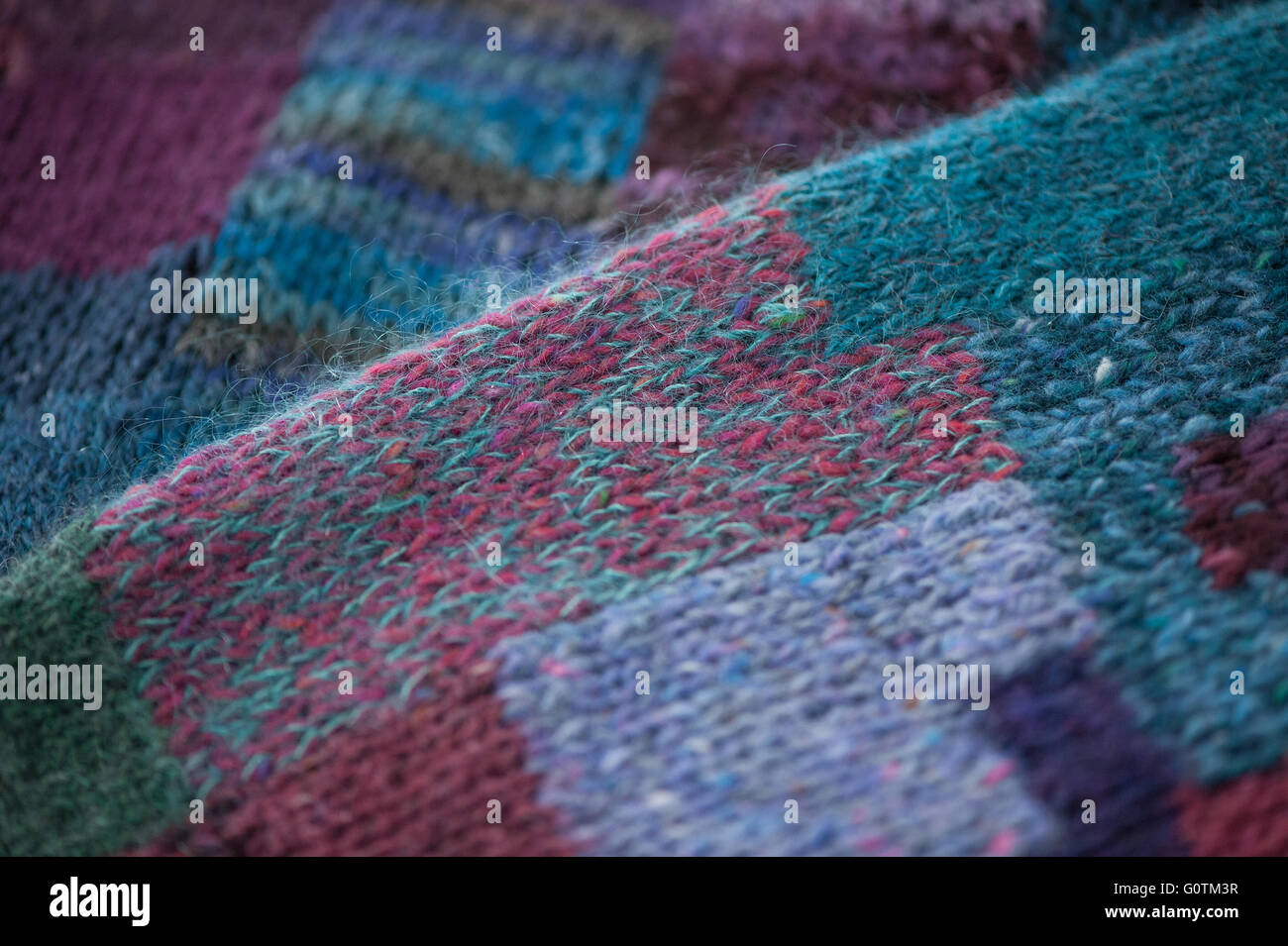 Hand knitted jumper detail showing block pattern patchwork effect Stock ...