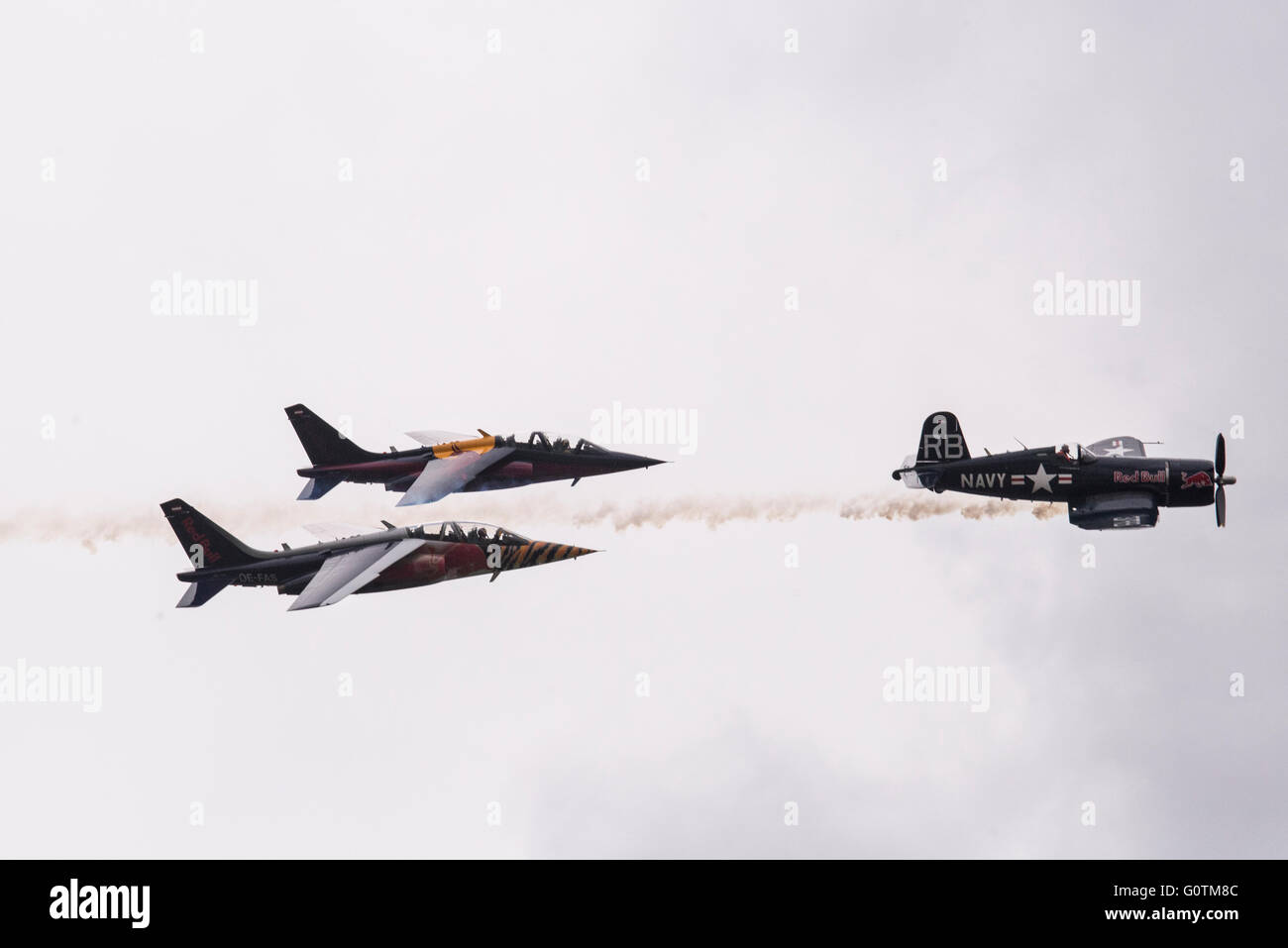 A formation of two Alpha Jets and a P-38 in front, of the Red Bull ...
