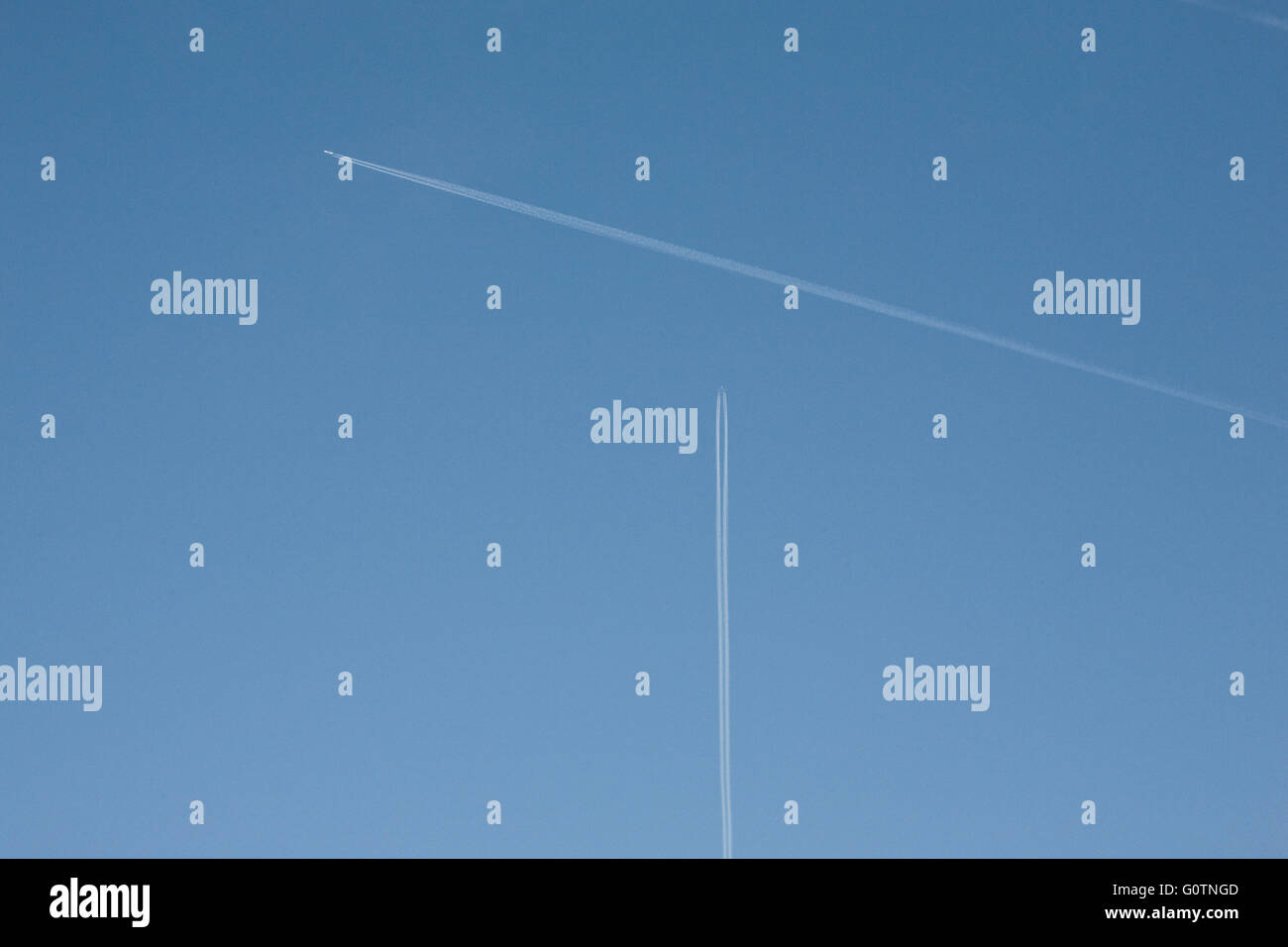 Two jet planes flying over Henley making a T shape clear blue morning ...