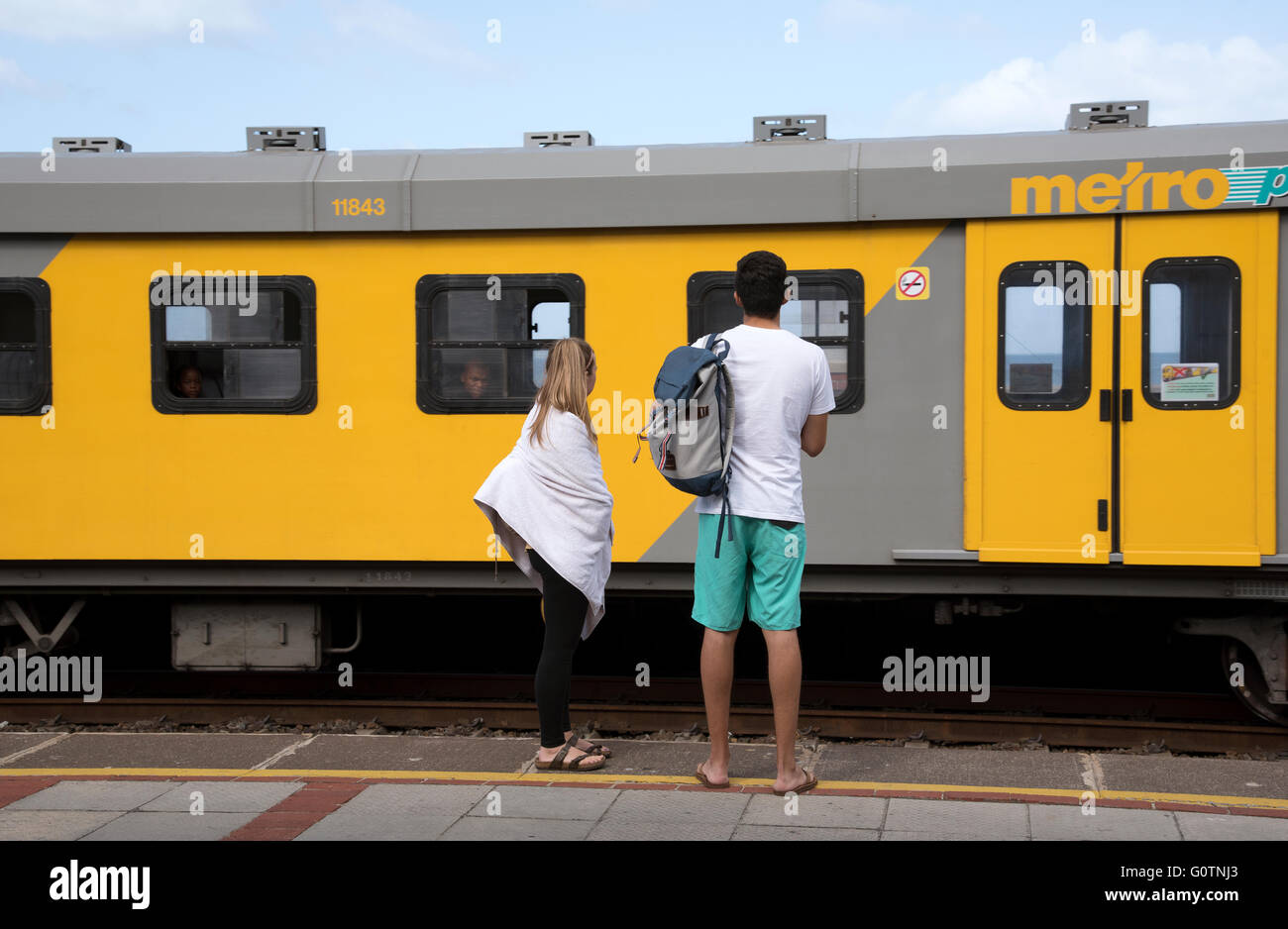 Young couple waiting for a railway train at Kalk Bay Station Western ...