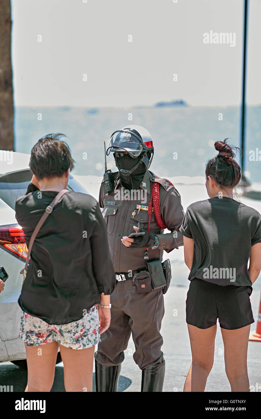 Thailand police officer questioning female drivers involved in the ...