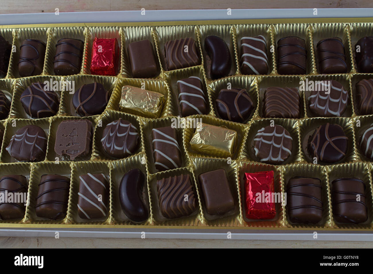 Big box of delicious, assorted chocolate pralines, as typical ...