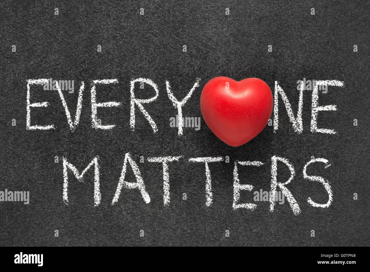 everyone matters phrase handwritten on blackboard with heart symbol ...