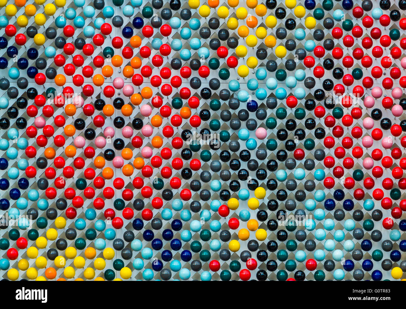 Mixer of color balls on a wall Stock Photo - Alamy