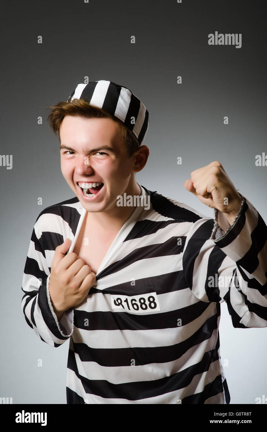 Funny prisoner in prison concept Stock Photo - Alamy