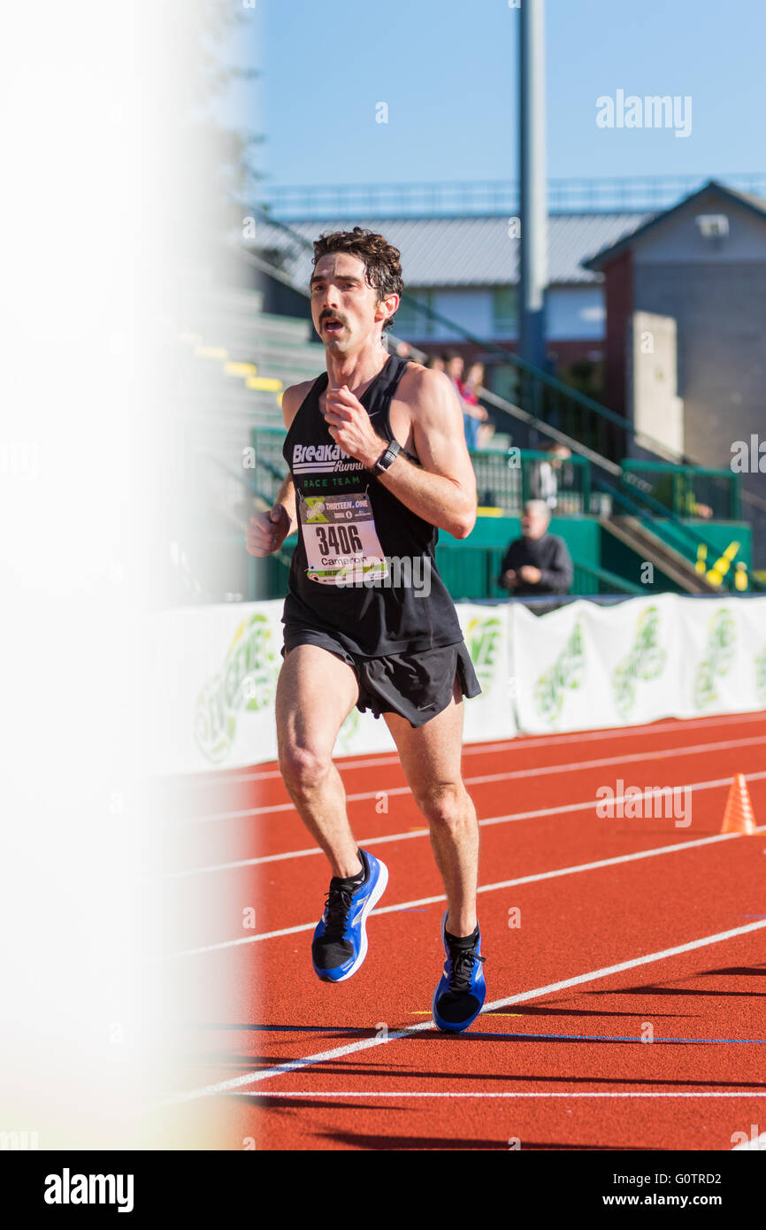 EUGENE, OR - MAY 1, 2016: Elite runner coming to the finish line for ...