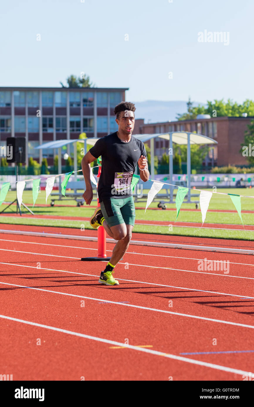 EUGENE, OR - MAY 1, 2016: Elite runner coming to the finish line for ...