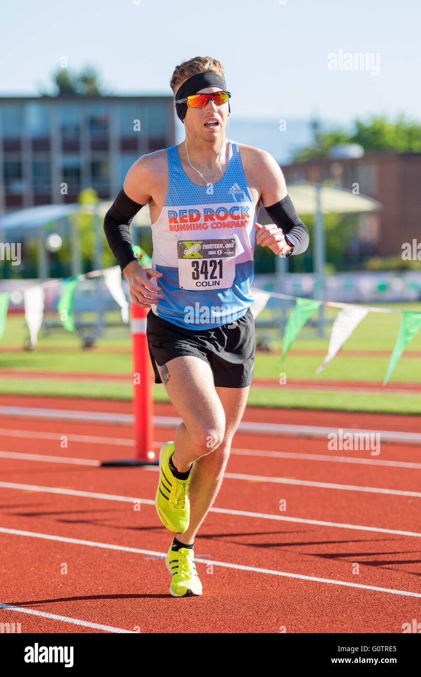 EUGENE, OR - MAY 1, 2016: Elite runner coming to the finish line for ...