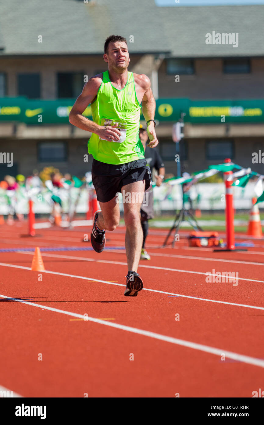 EUGENE, OR - MAY 1, 2016: Runner approaching the finish line on the ...
