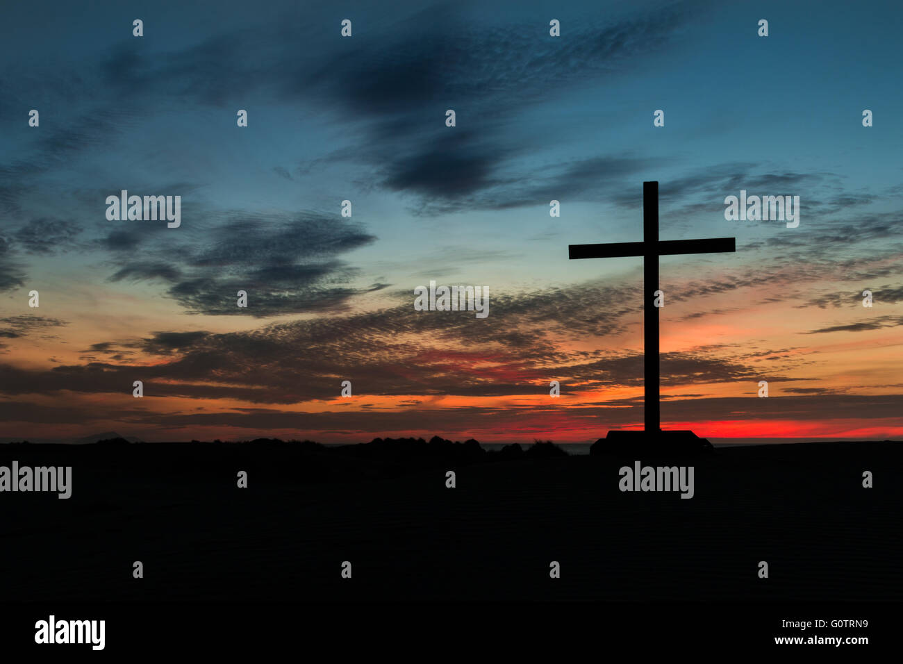 Cross with a wonderful colorful sunset Stock Photo - Alamy