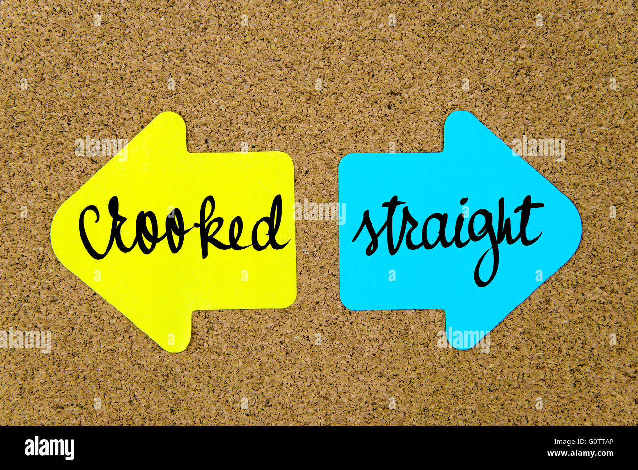 Conceptual message on yellow and blue paper notes as opposite arrows ...