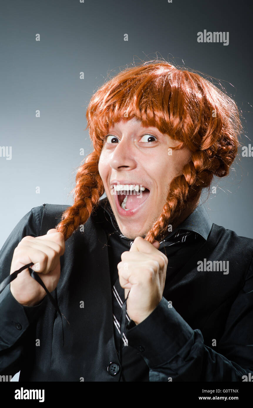 Funny man with red hair wig Stock Photo - Alamy