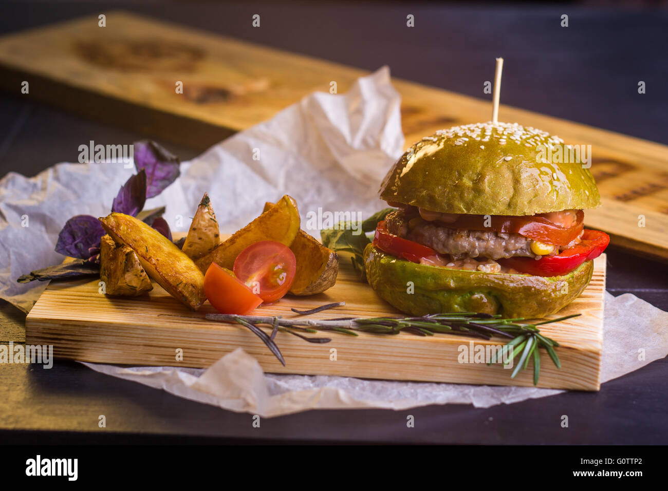 gourmet homemade burger with garnish Stock Photo - Alamy