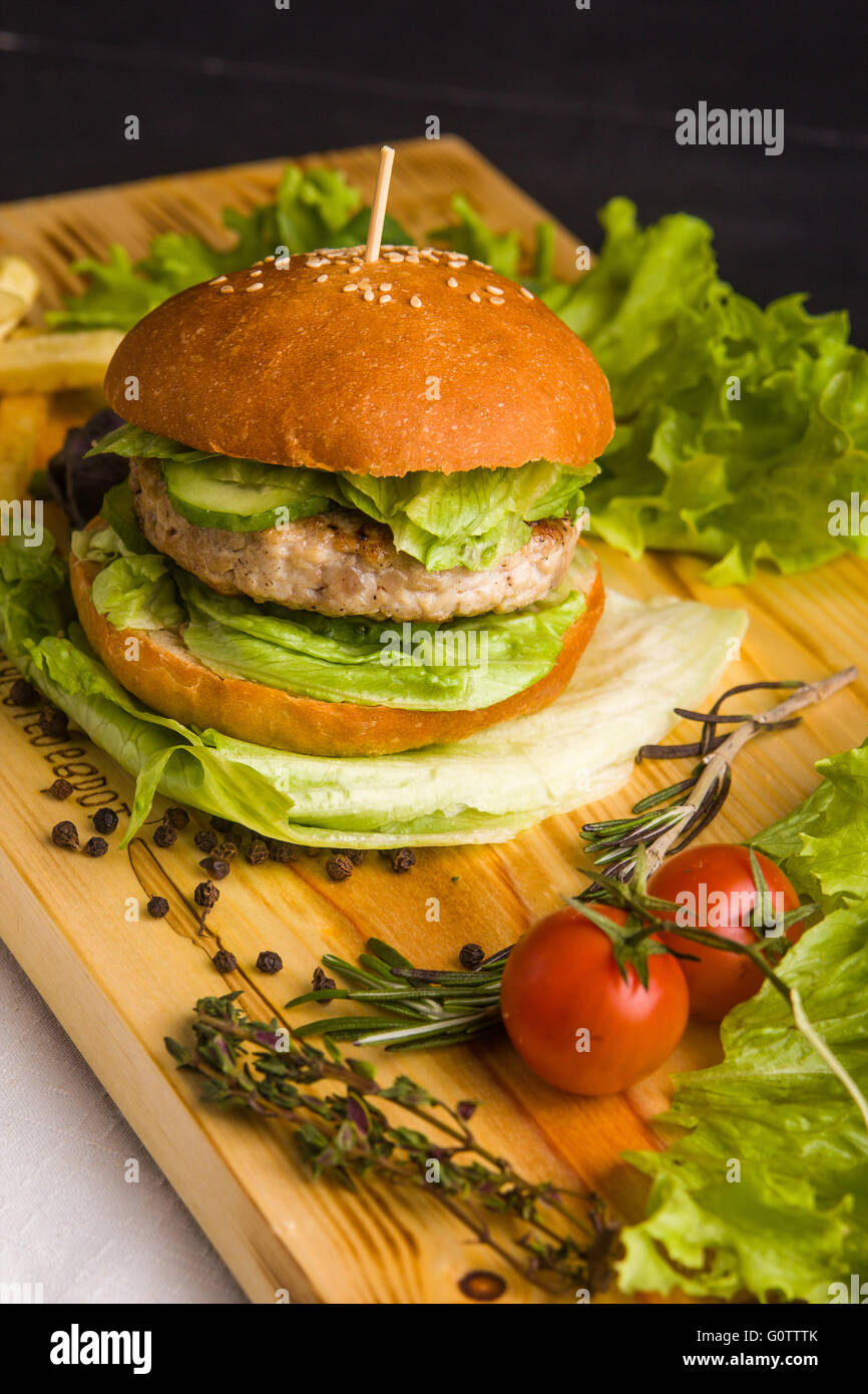 gourmet homemade burger with garnish Stock Photo - Alamy