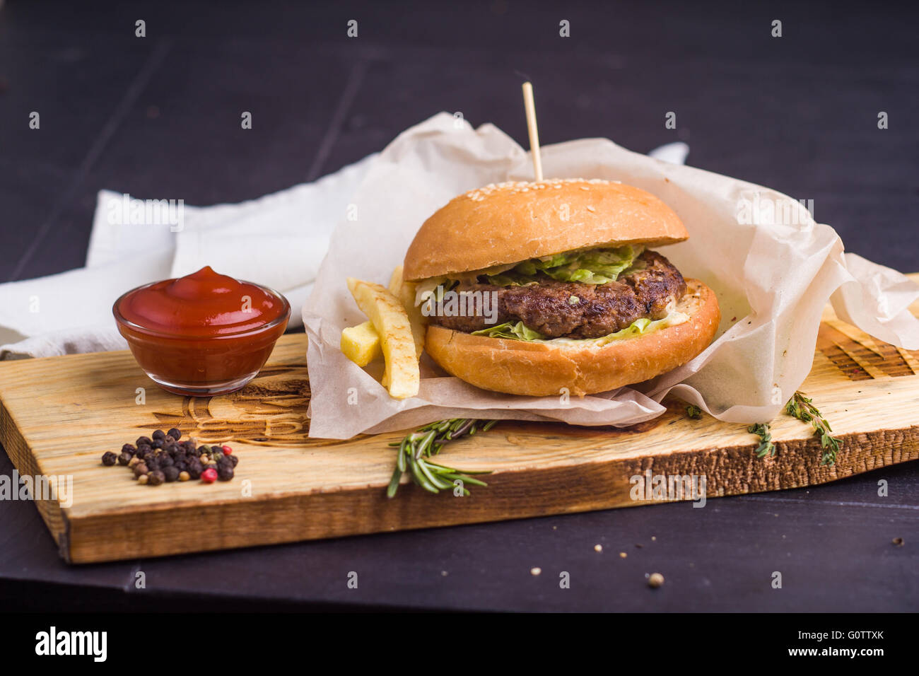 Concept: healthy food. Gourmet homemade burger with garnish and ...