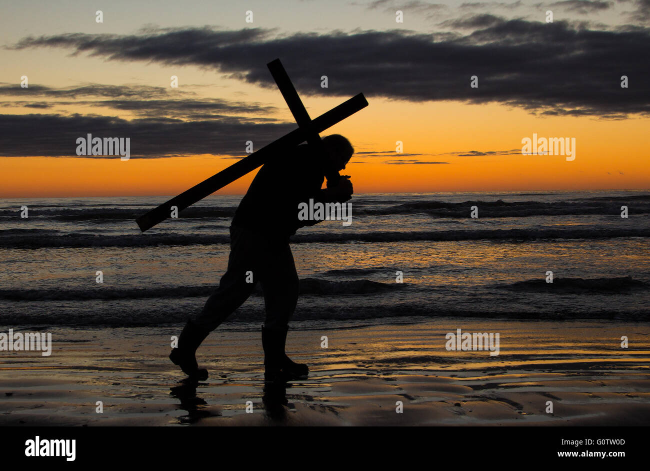 Man carring His cross on this back Stock Photo - Alamy