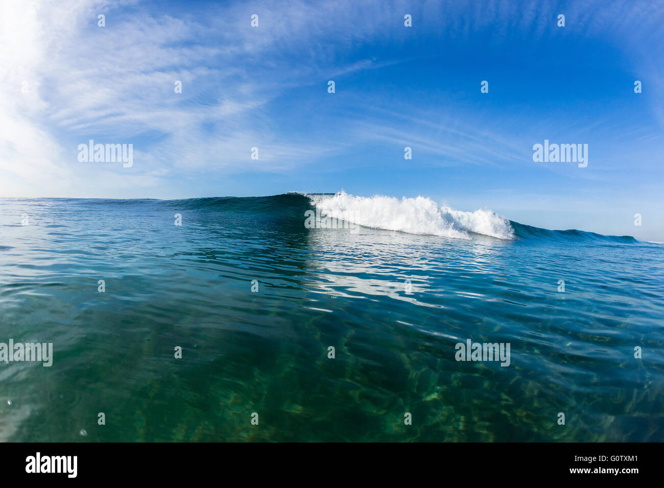 Ocean blue wave crashing white water swimming inside closeup encounter ...