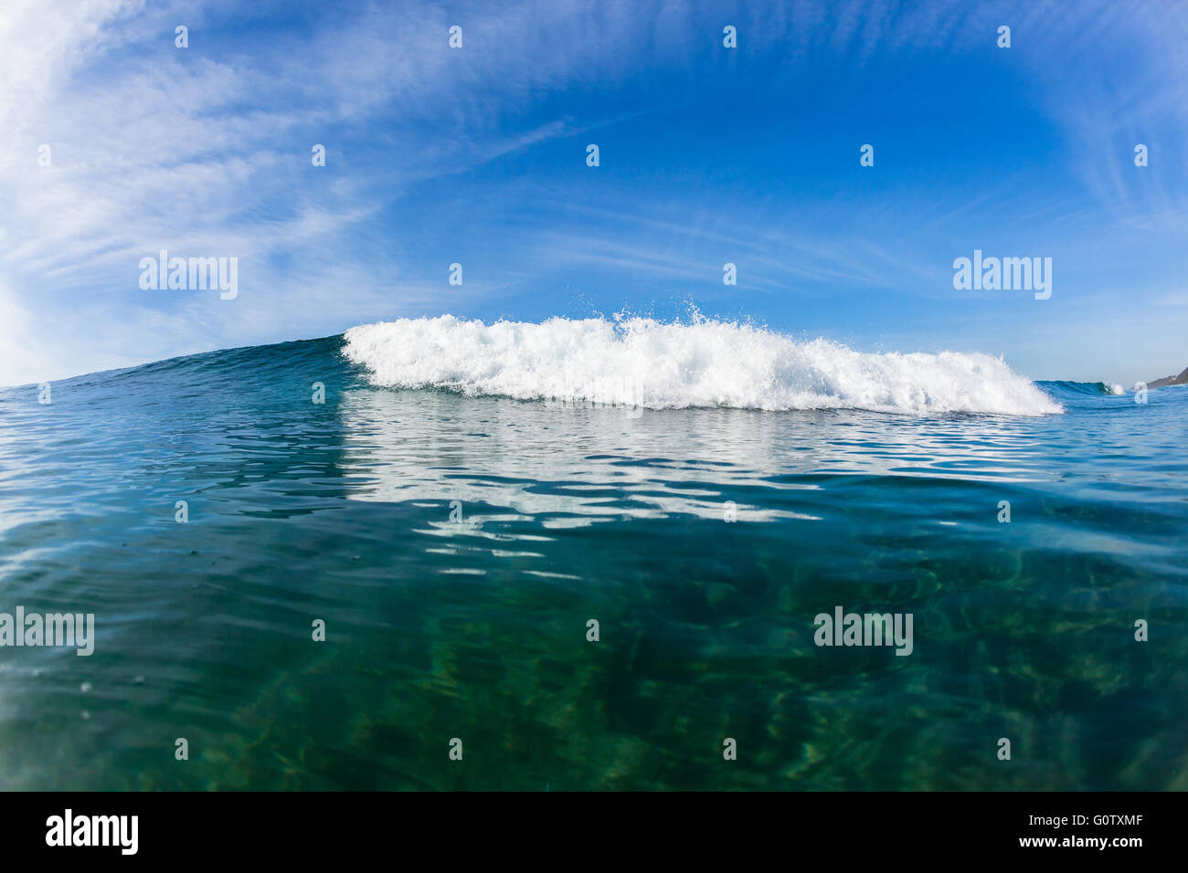 Ocean blue wave crashing white water swimming inside closeup encounter ...