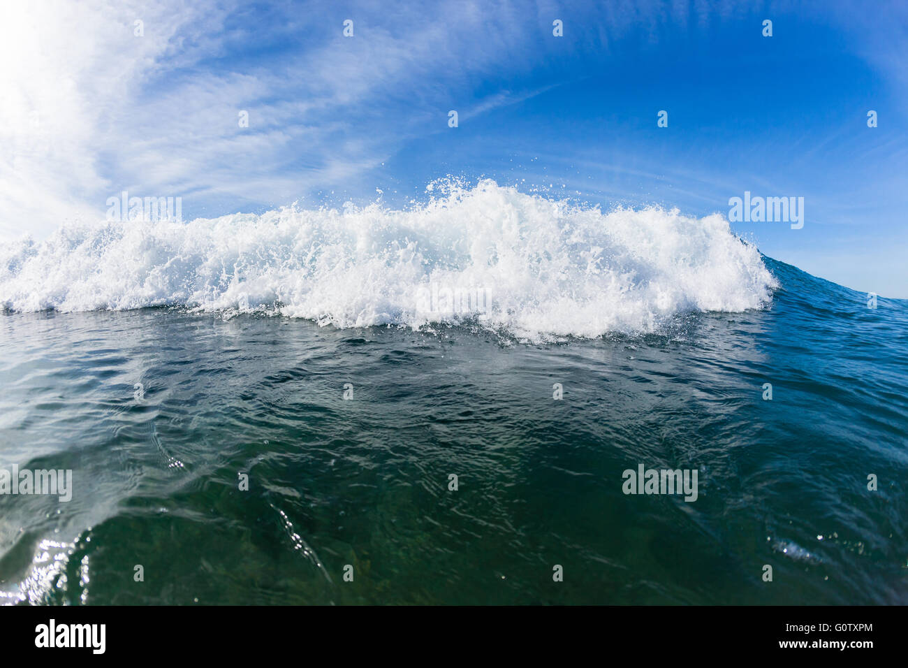 Ocean blue wave crashing white water swimming inside closeup encounter ...