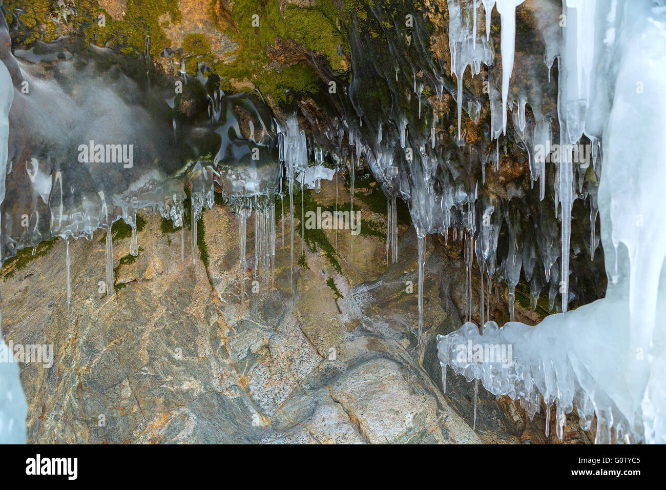 Huge icicles on a cliff Stock Photo - Alamy