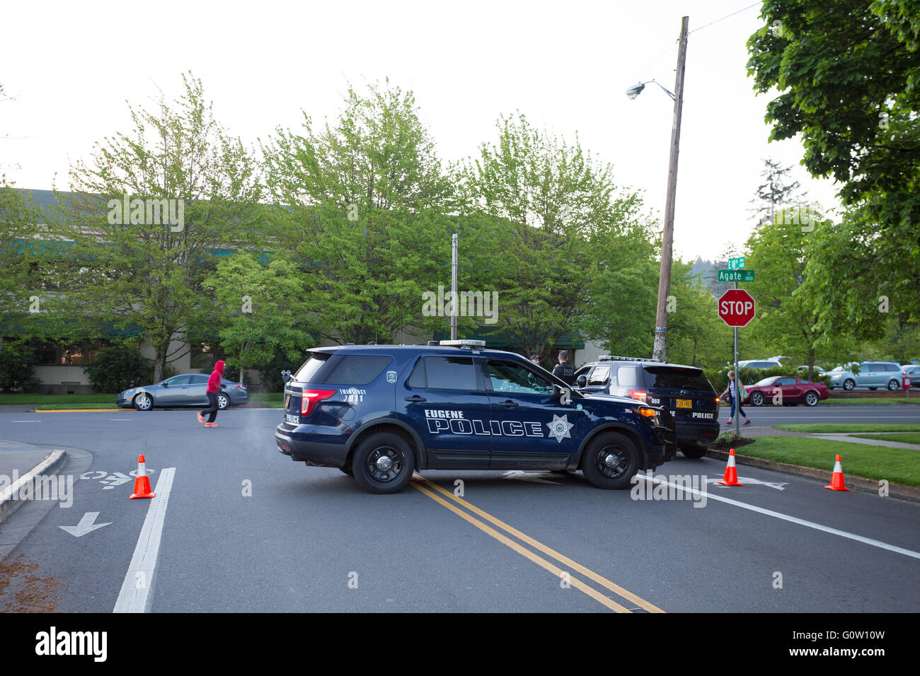 EUGENE, OR - MAY 1, 2016: Police cars block a street intersection so ...