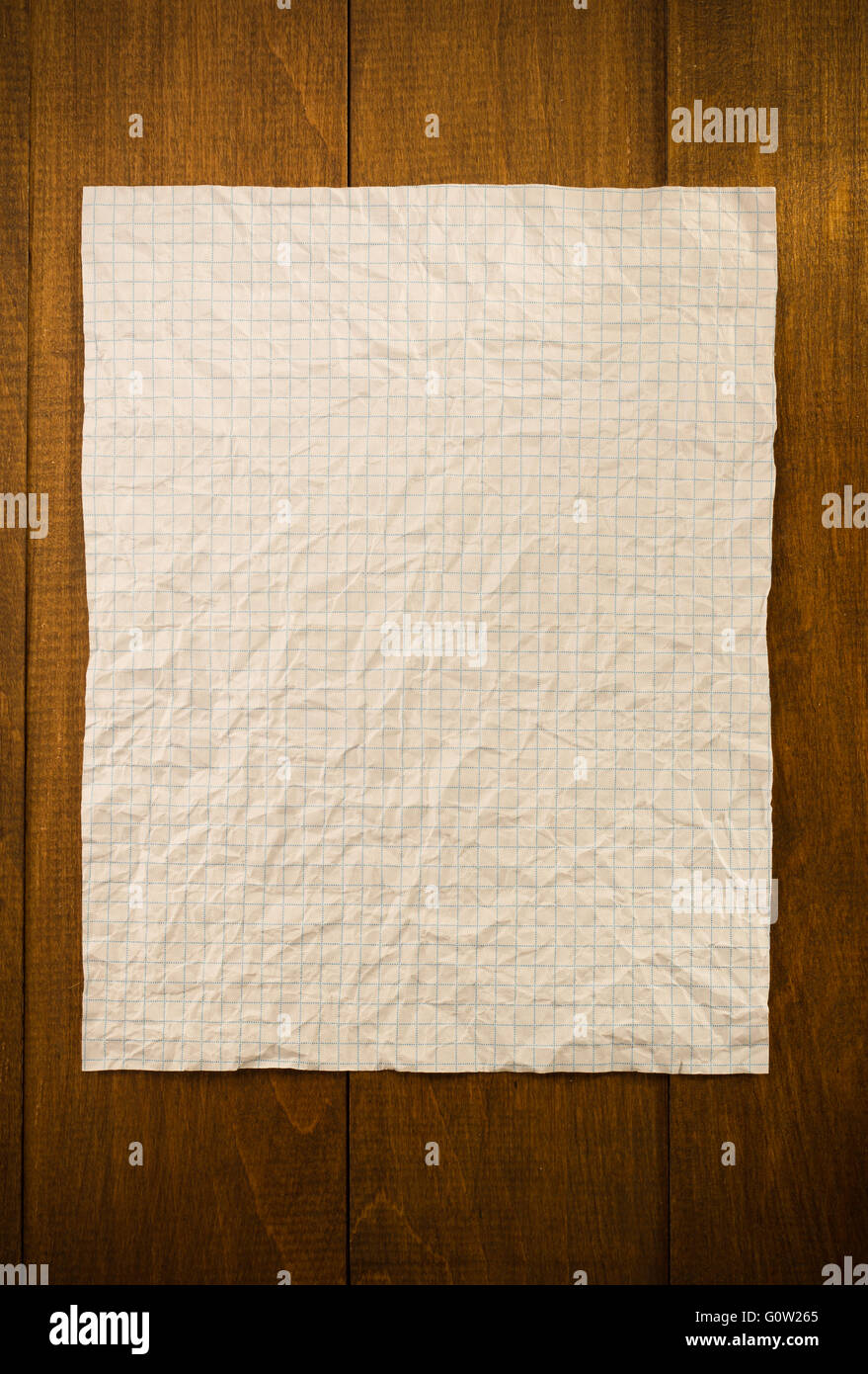 wrinkled note paper on wooden background Stock Photo - Alamy